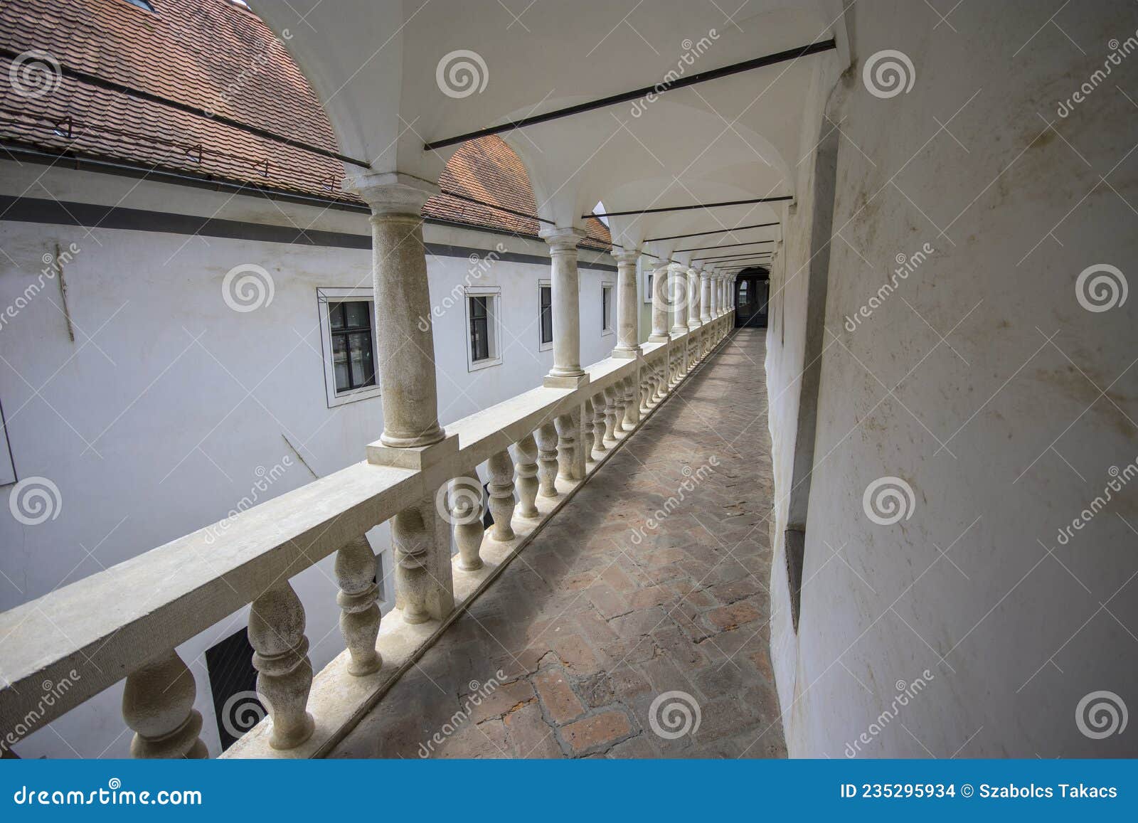 Long Outside Covered Corridor with Stone Railing Stock Photo - Image of ...