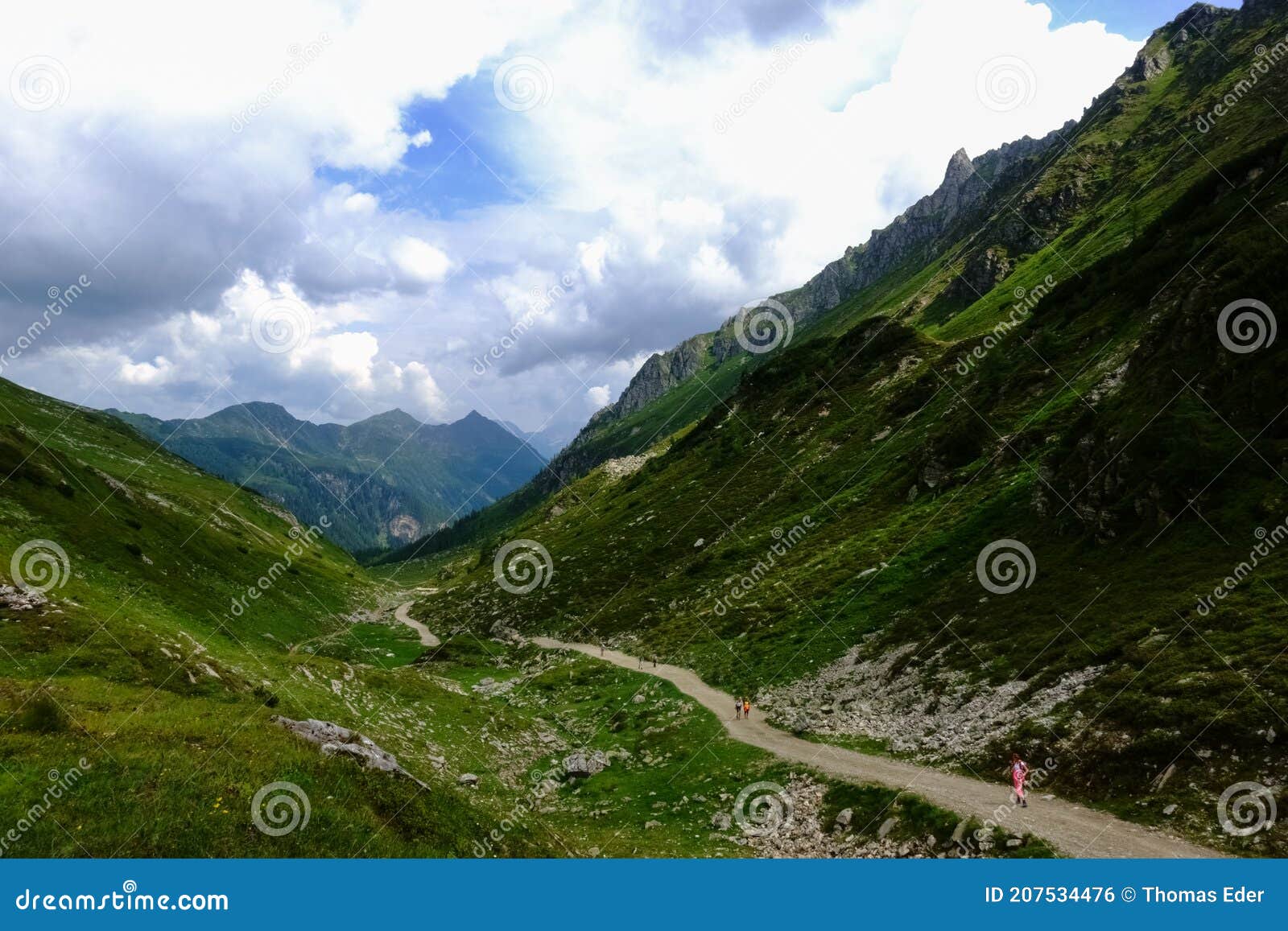 Long Path with Colorful Hikers in the Mountains Stock Photo - Image of ...