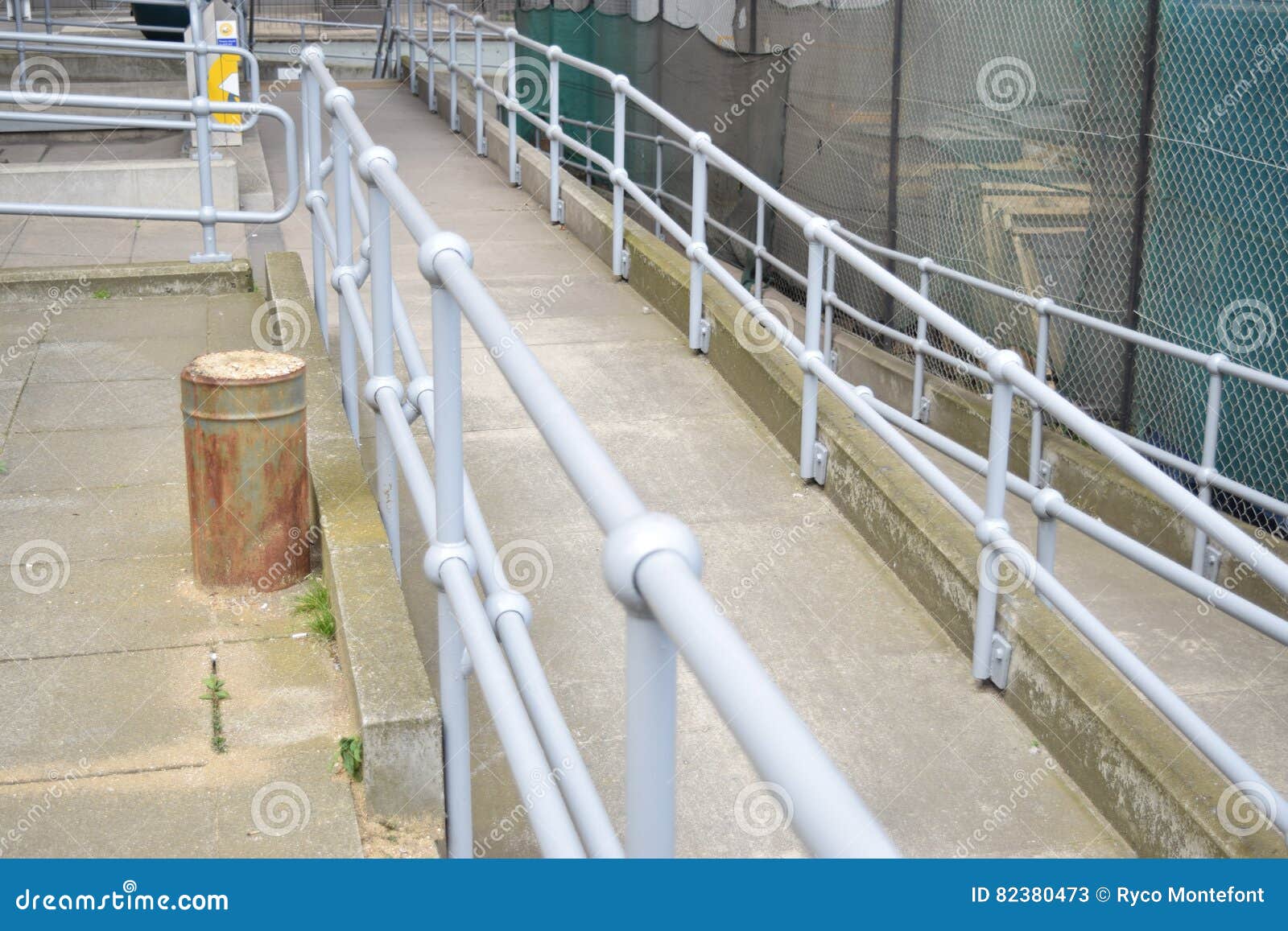 Long Pathway with Sliver Railings Leading To a Corner Stock Image ...