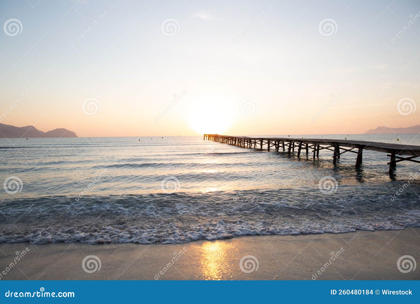 Long Pier in the Sea at Sunset Stock Photo - Image of scenic, outdoor ...