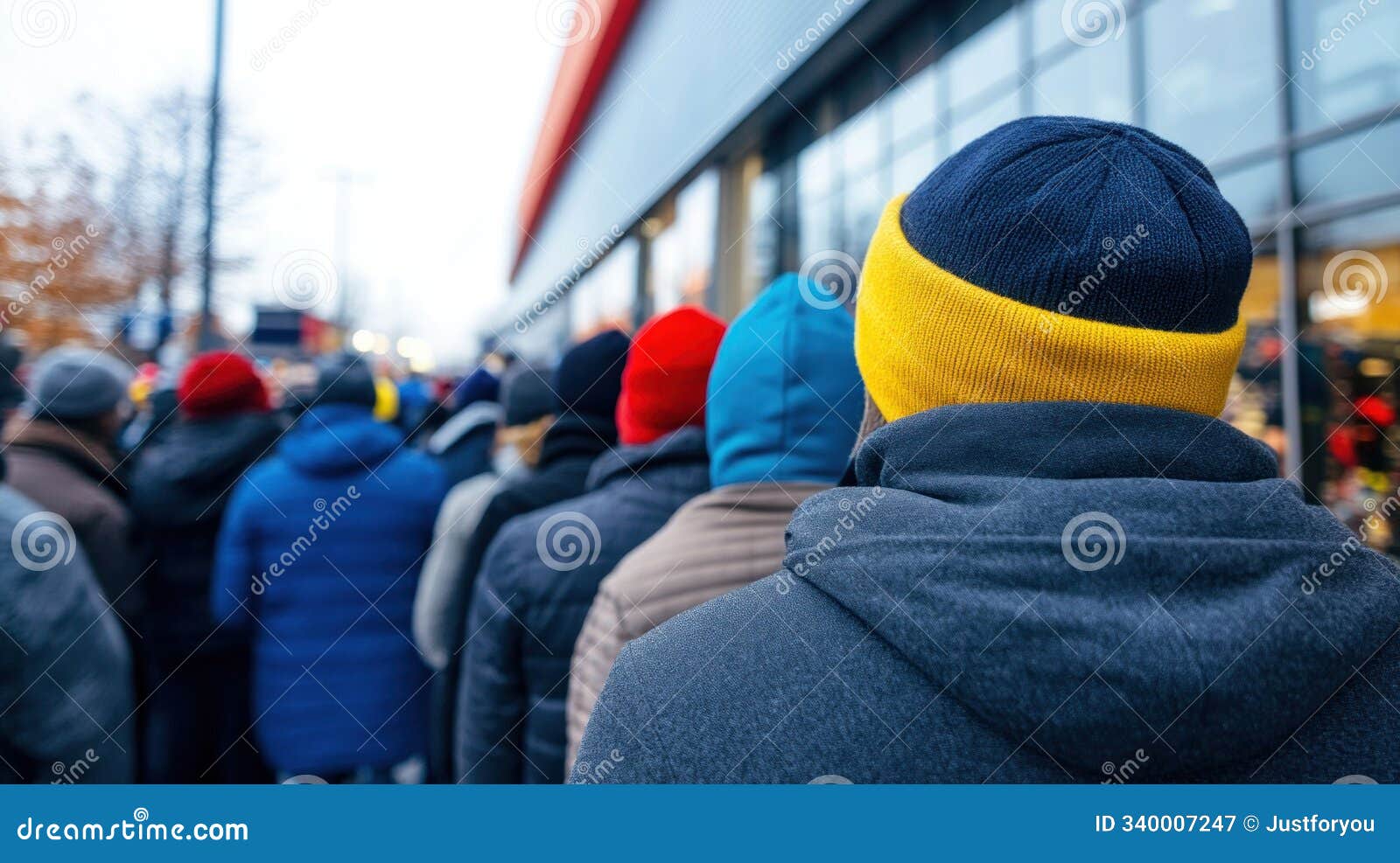 Long Queue of People Waiting Outdoors in Cold Weather Stock ...