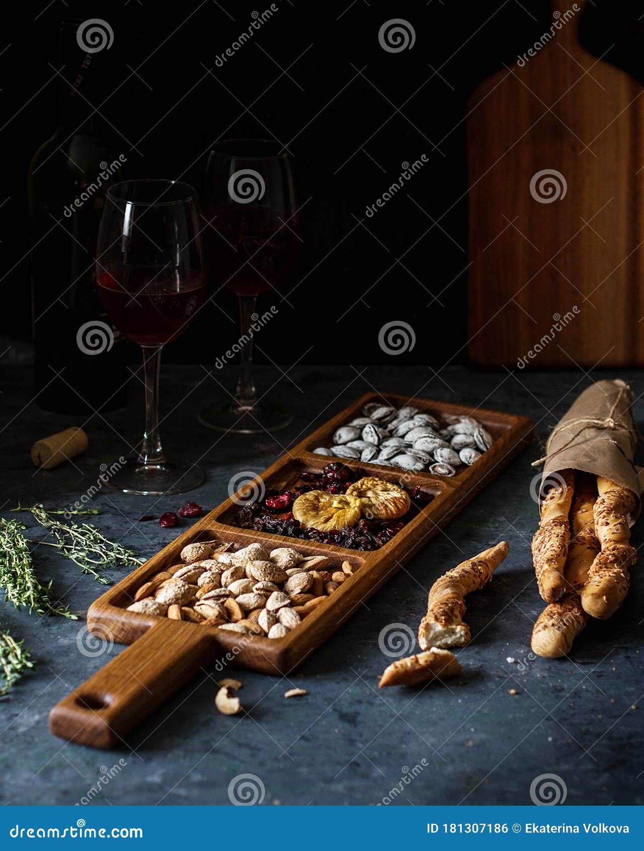 A Long Rectangular Wooden Mini-bar for Snacks on a Table with Wine ...