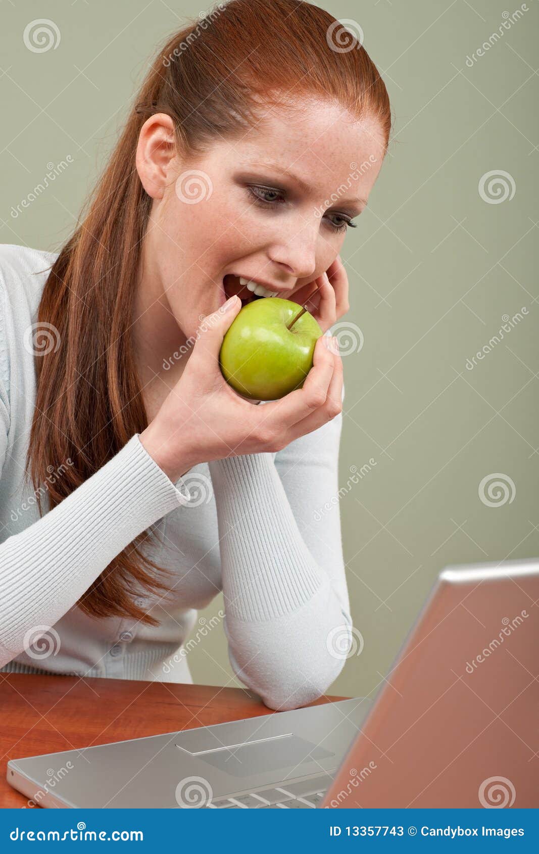 Long Red Hair Woman Biting Apple at Office Stock Image - Image of ...