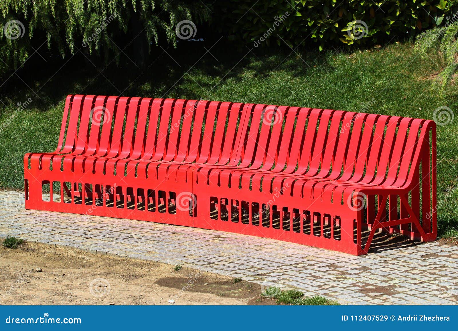 Long Red Metal Bench in a Public Park Stock Image - Image of garden ...