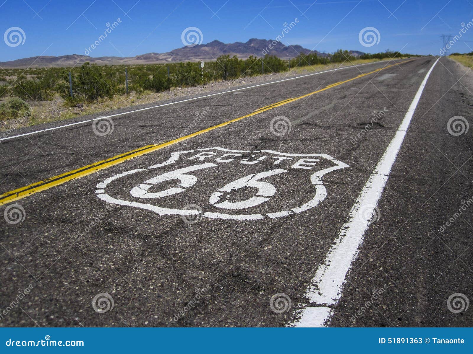 Long Road with a Route 66 Sign Painted on it Stock Image - Image of ...