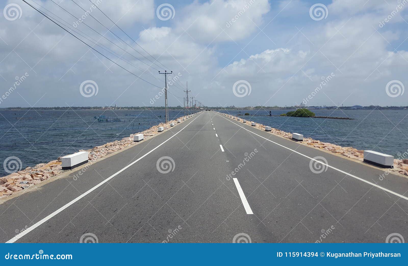 Road with Water on Either Side Stock Photo - Image of long, water ...
