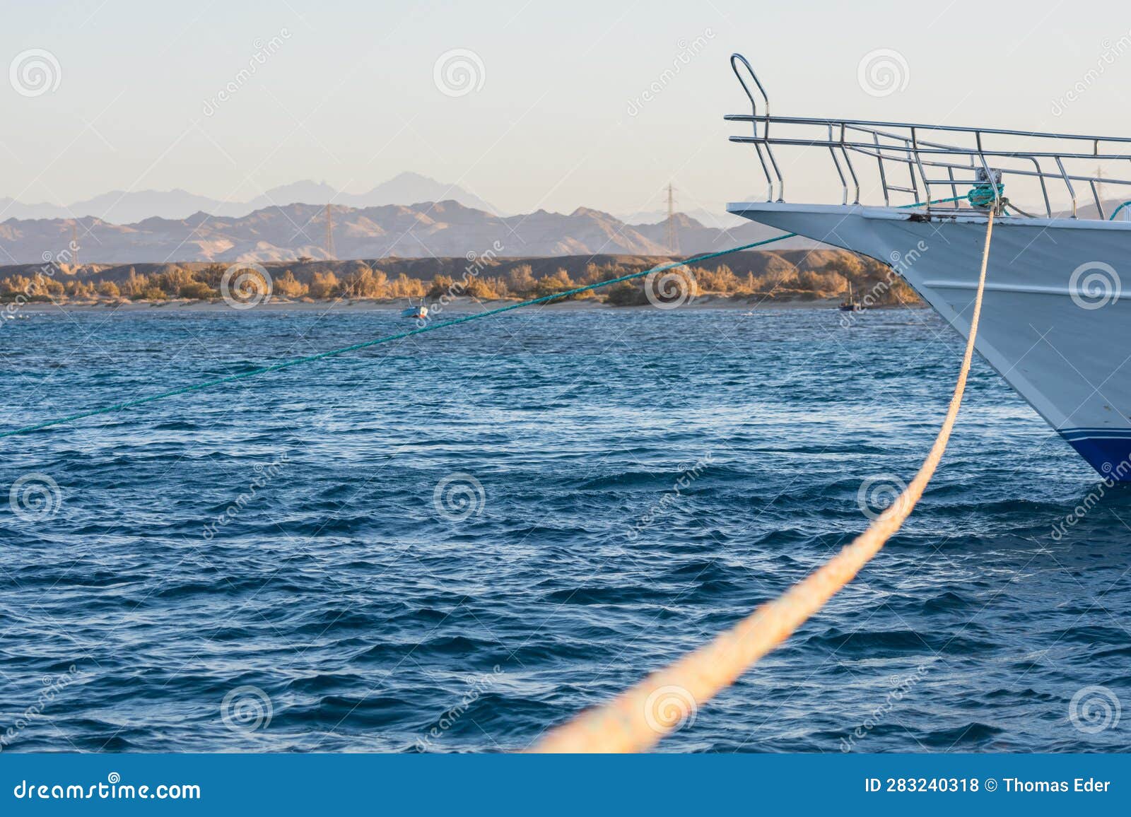 Long Rope from the Attachment To a White Boat at the Sea Stock Photo ...