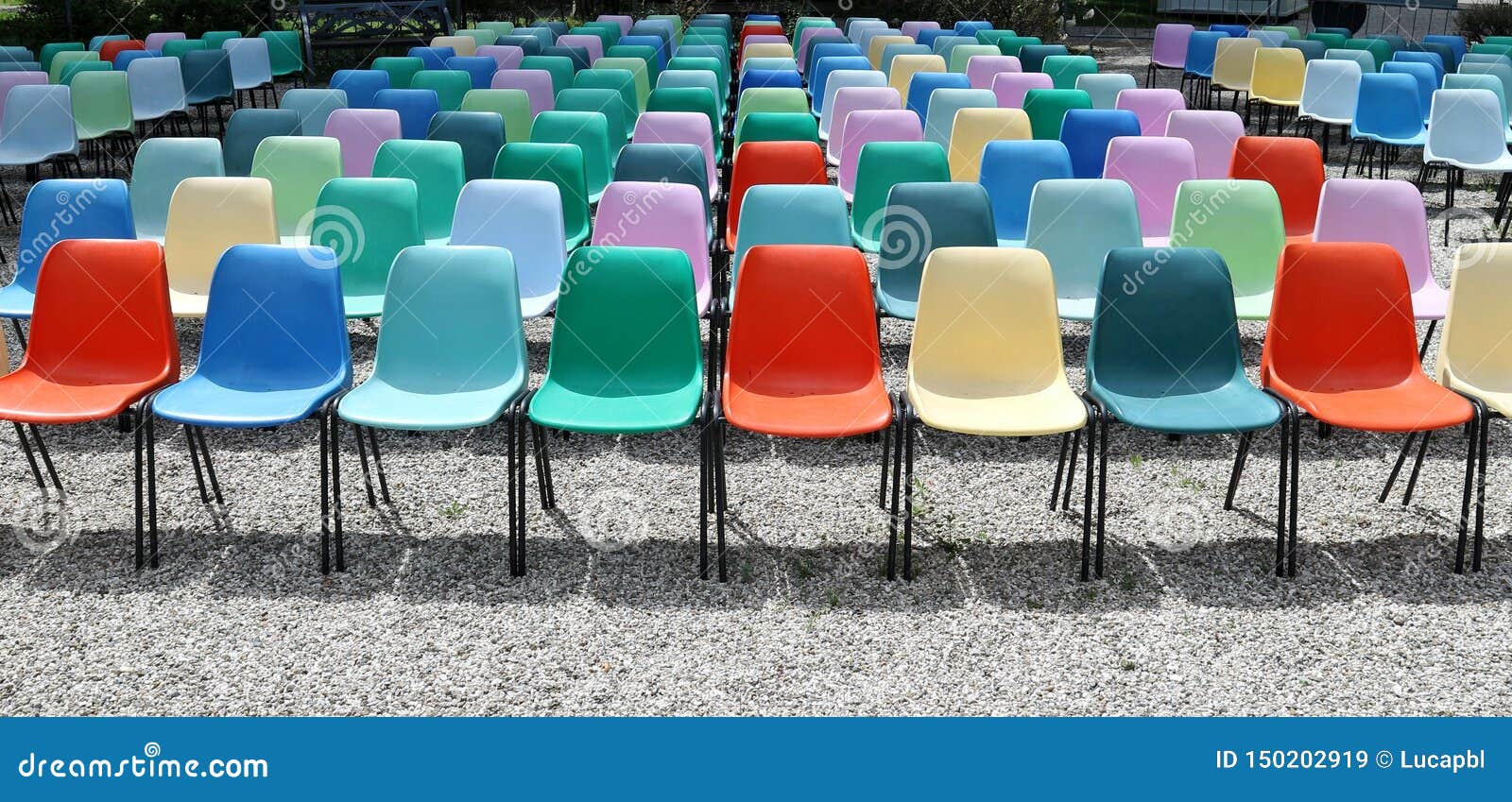 Long Rows of Empty Colorful Plastic Chairs Geometrically Arranged Under ...