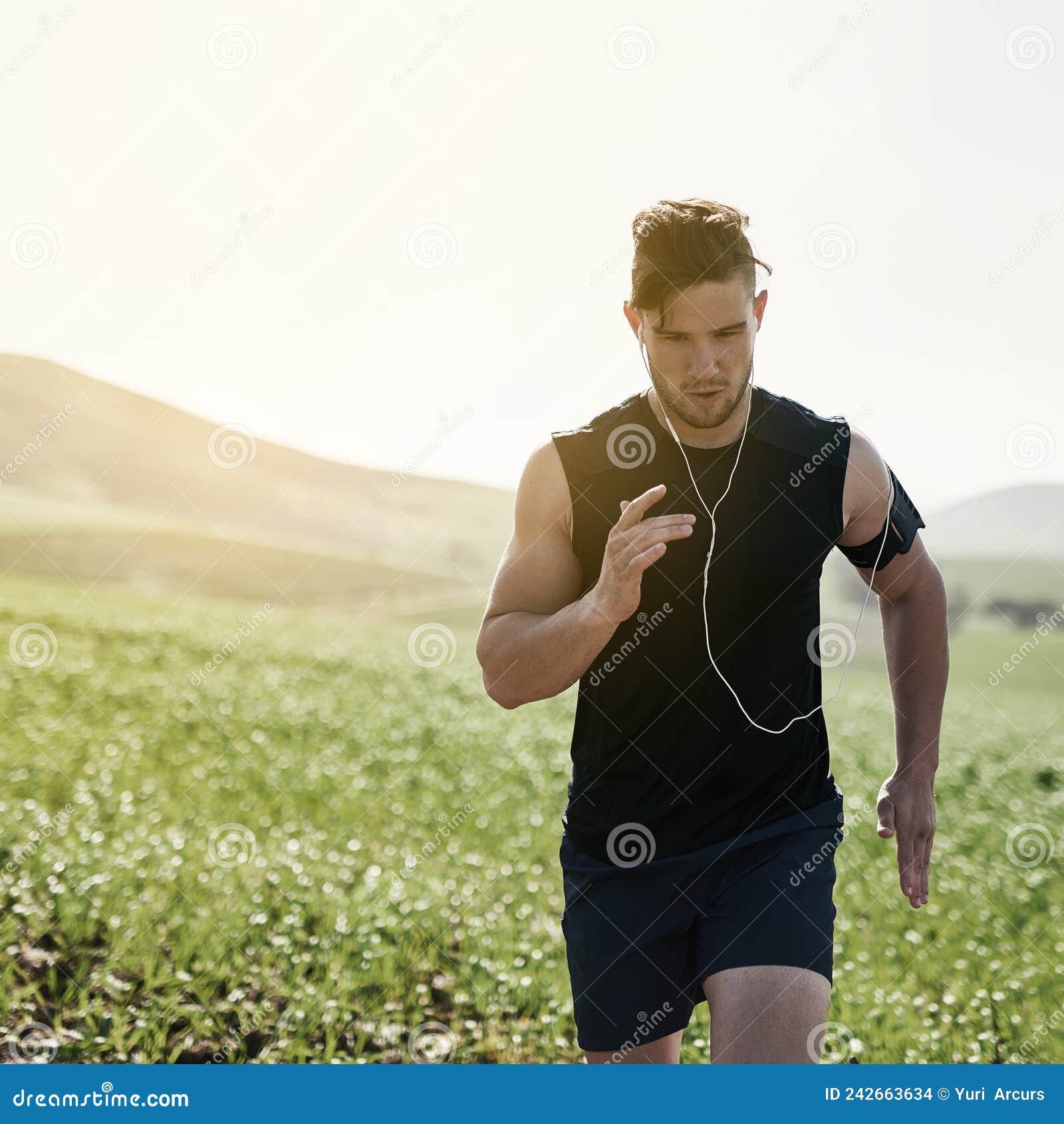 In it for the Long Run. Cropped Shot of a Handsome Young Man Running ...