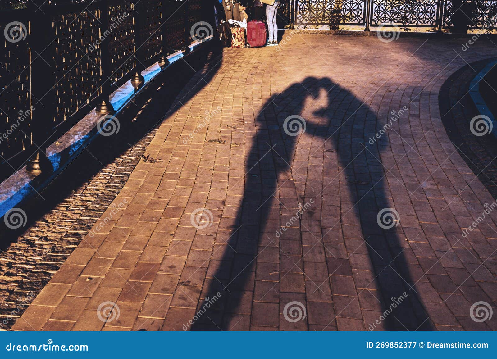 Long Shadow of a Couple on the Pavement Facing Each Other Stock Image ...