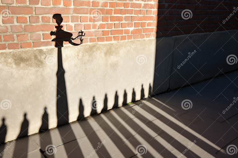 Long Shadow of a Key Falling on a Vertical Arrangement of Bricks Stock ...