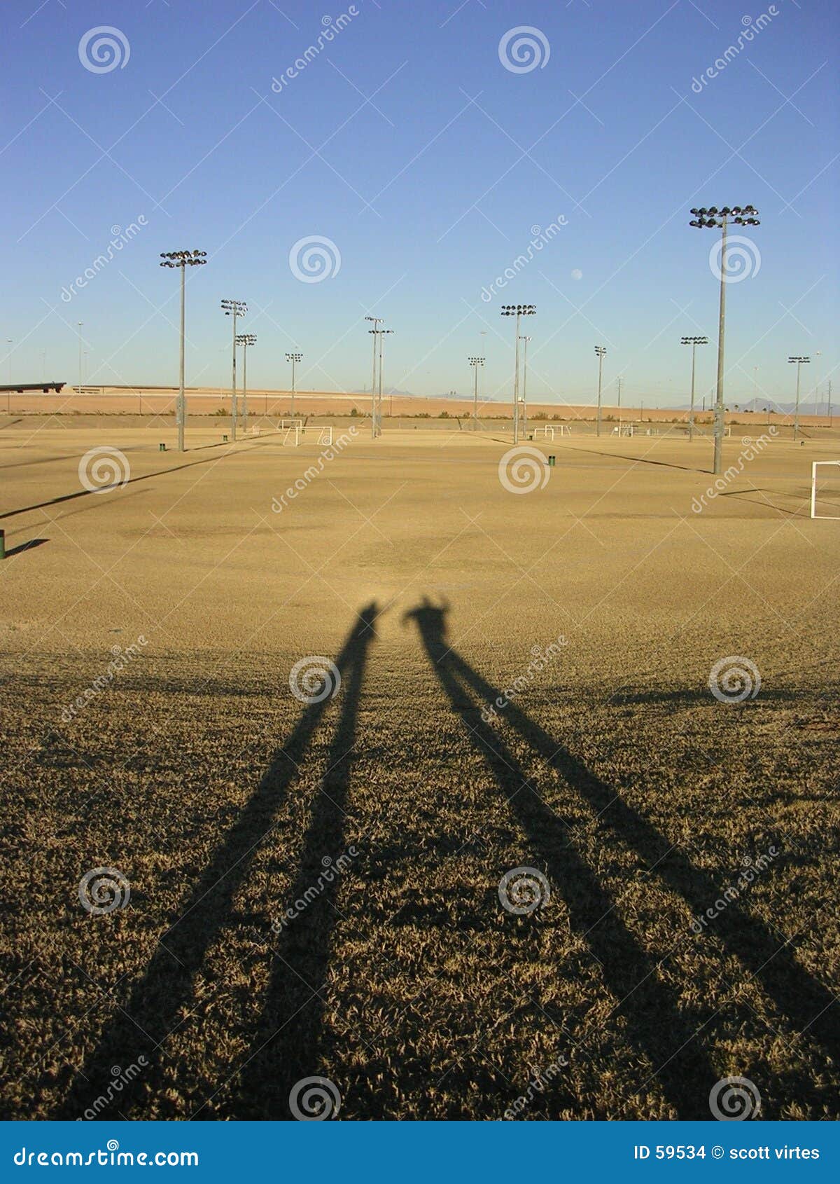 Long shadows on dead field stock photo. Image of games, competition - 59534