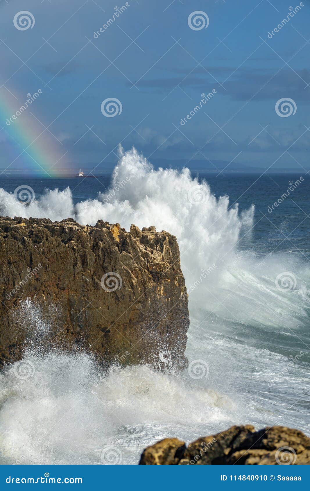 Wild Waves Breaking Over Cliff with Rainbow Stock Photo - Image of ...