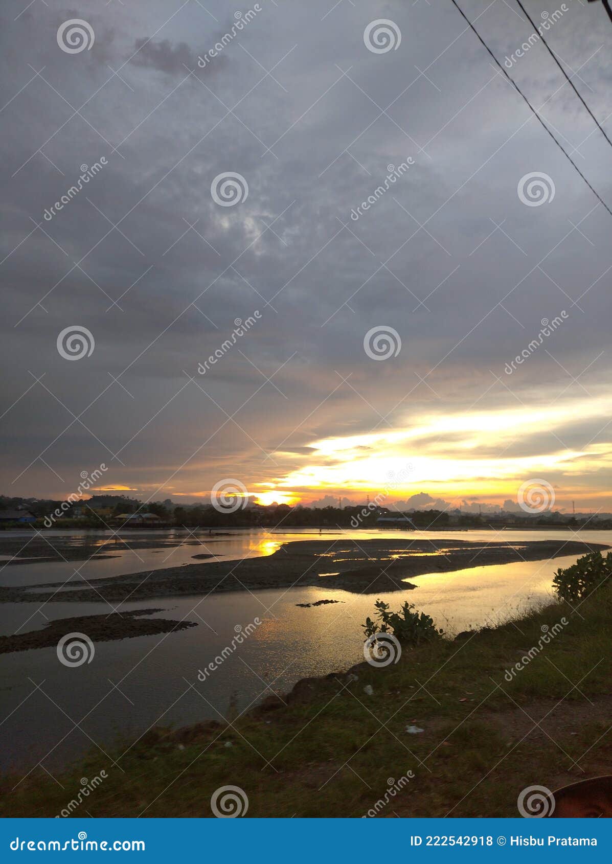 Long sky Sunsets stock photo. Image of shore, sunsets - 222542918