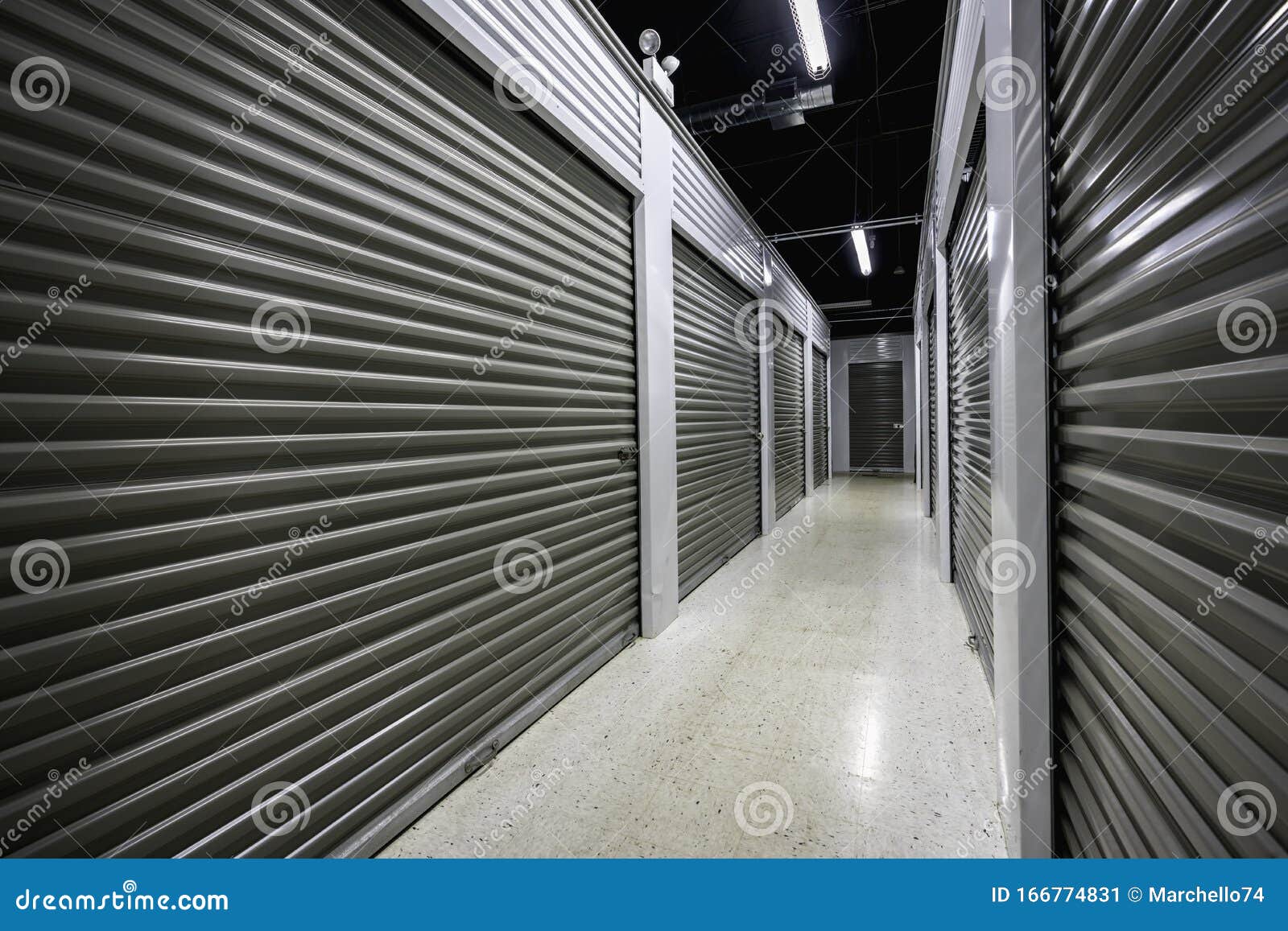 Long Storage Facility Corriodor. Garage Doors with Light Stock Image ...