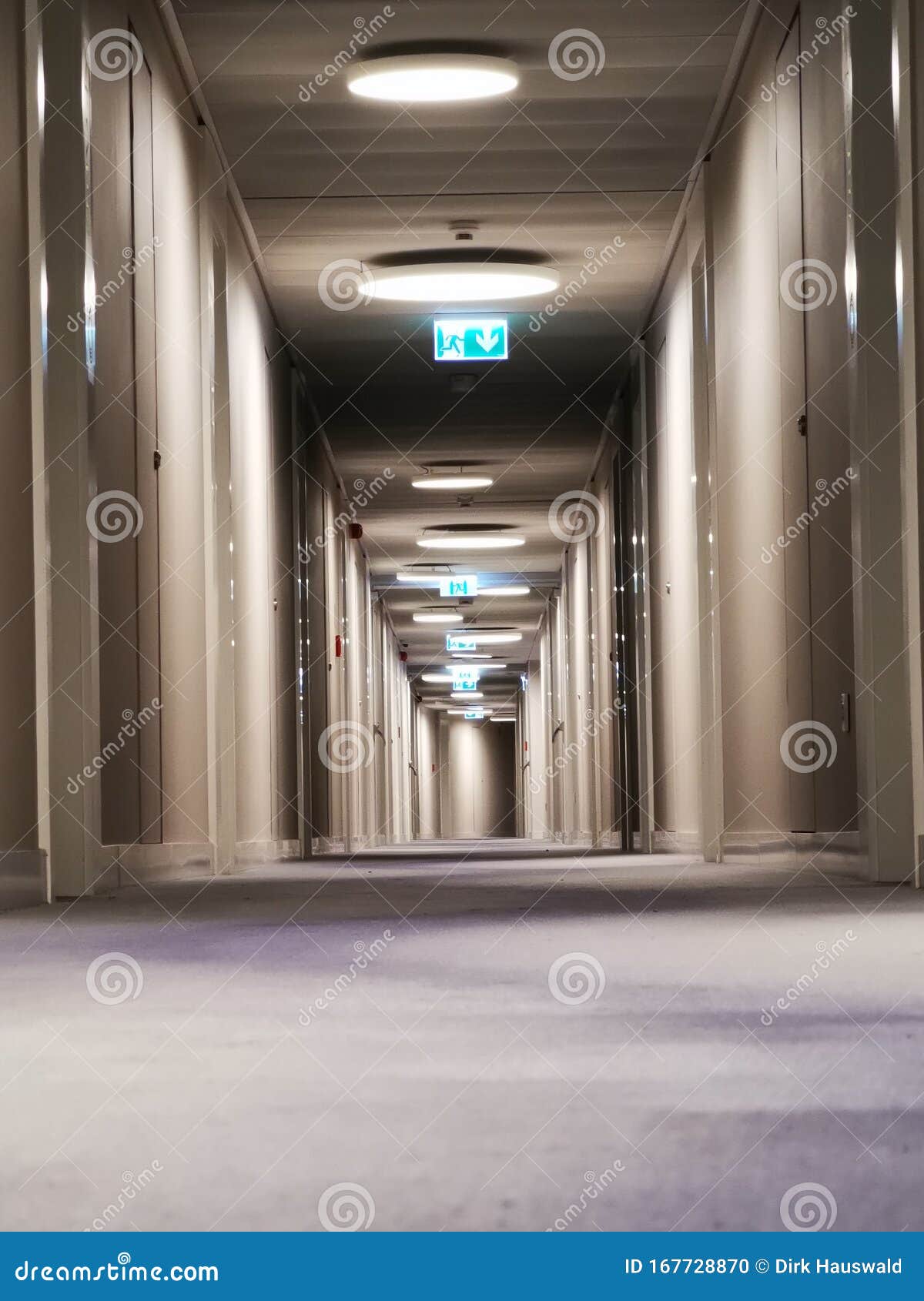 Long Straight Illuminated Hallway from a Hotel with Mirror Perspective ...