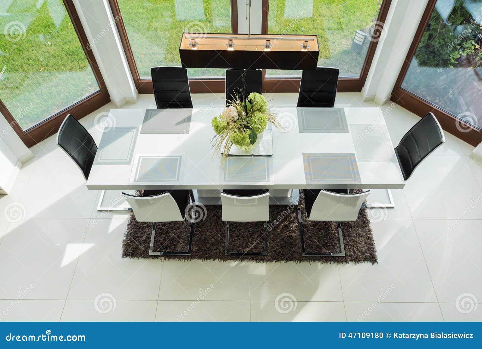 Long table in dinning room stock photo. Image of prestige - 47109180