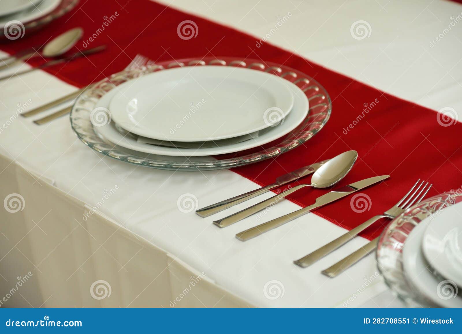 A Long Table with Plates, Silverware and Silverware Stock Image - Image ...