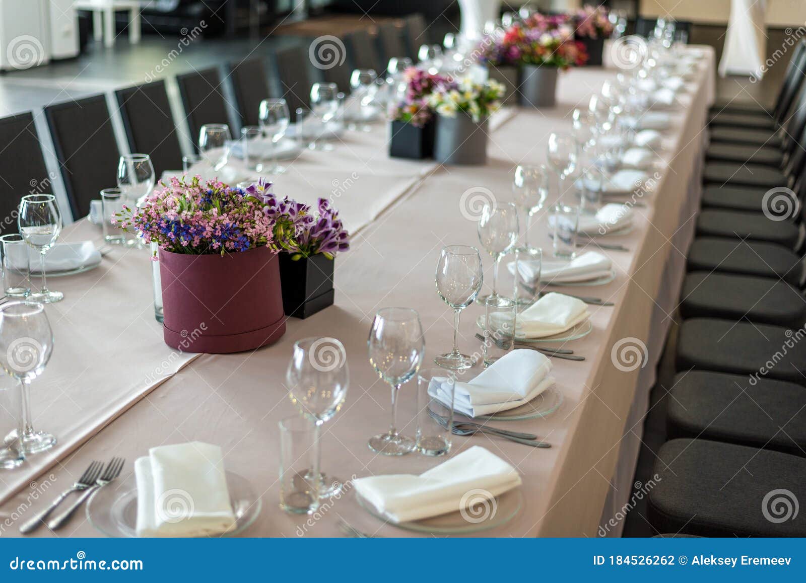 A Long Table Served with Dishes and Flowers. Horizontal Frame Stock ...