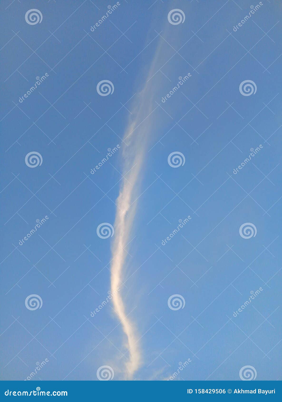 Long Thin Clouds Against the Background of a Bright Blue Sky Stock ...