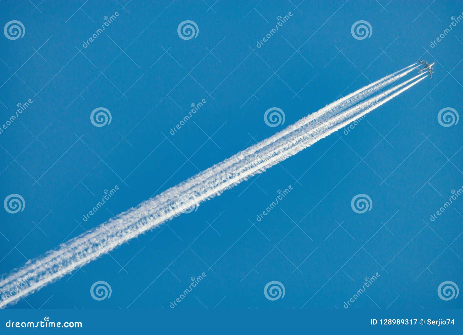 A long trail of jet plane. stock image. Image of fast - 128989317