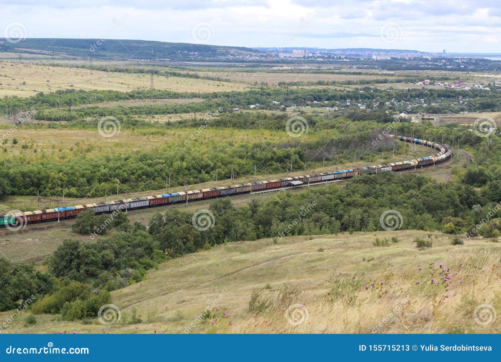 A Long Train Loaded with Double-stack Cargo Containers Winds Its Way ...