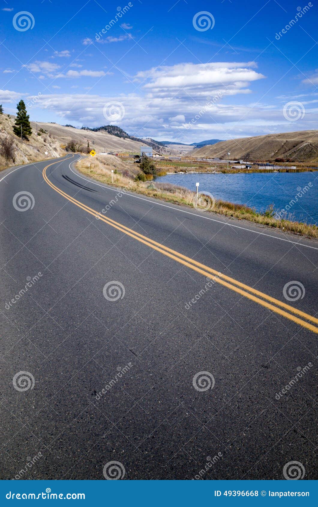 Long Two - Way Road with Lake on the Side Stock Photo - Image of ...
