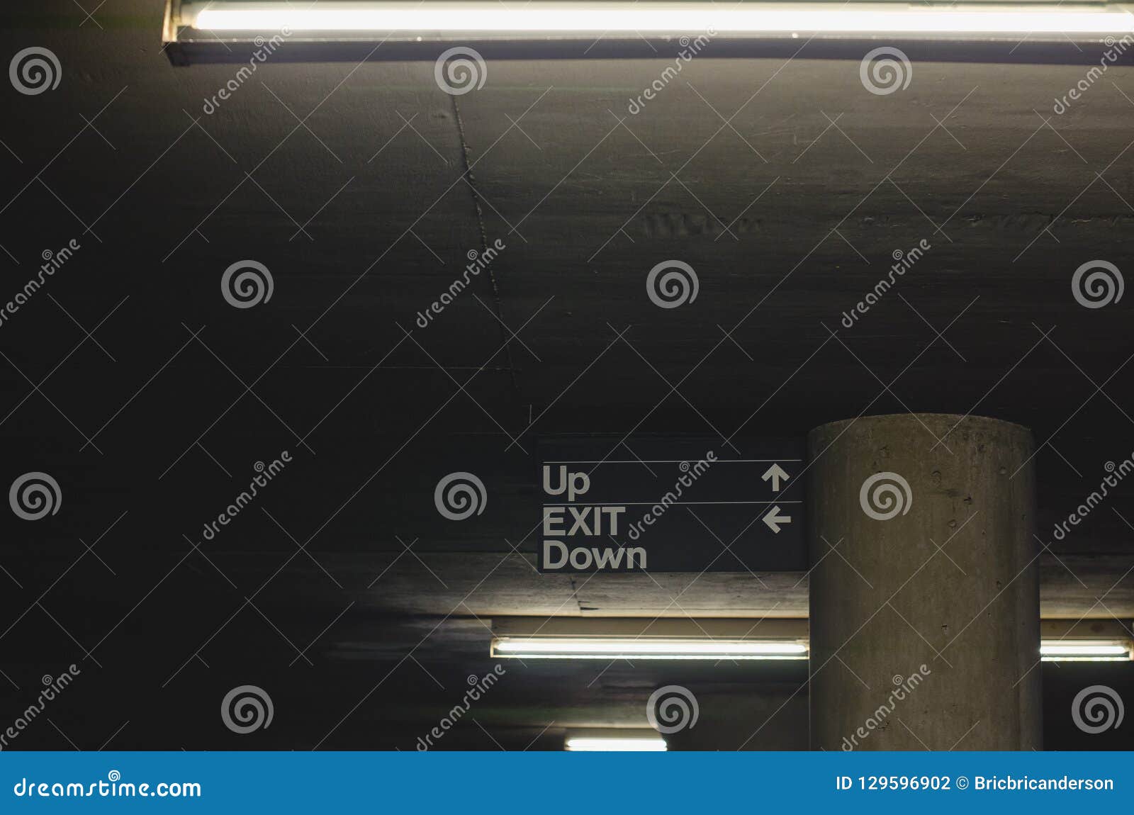 The Dark Parking Garage Exit Sign Arrows Stock Photo - Image of arrow ...