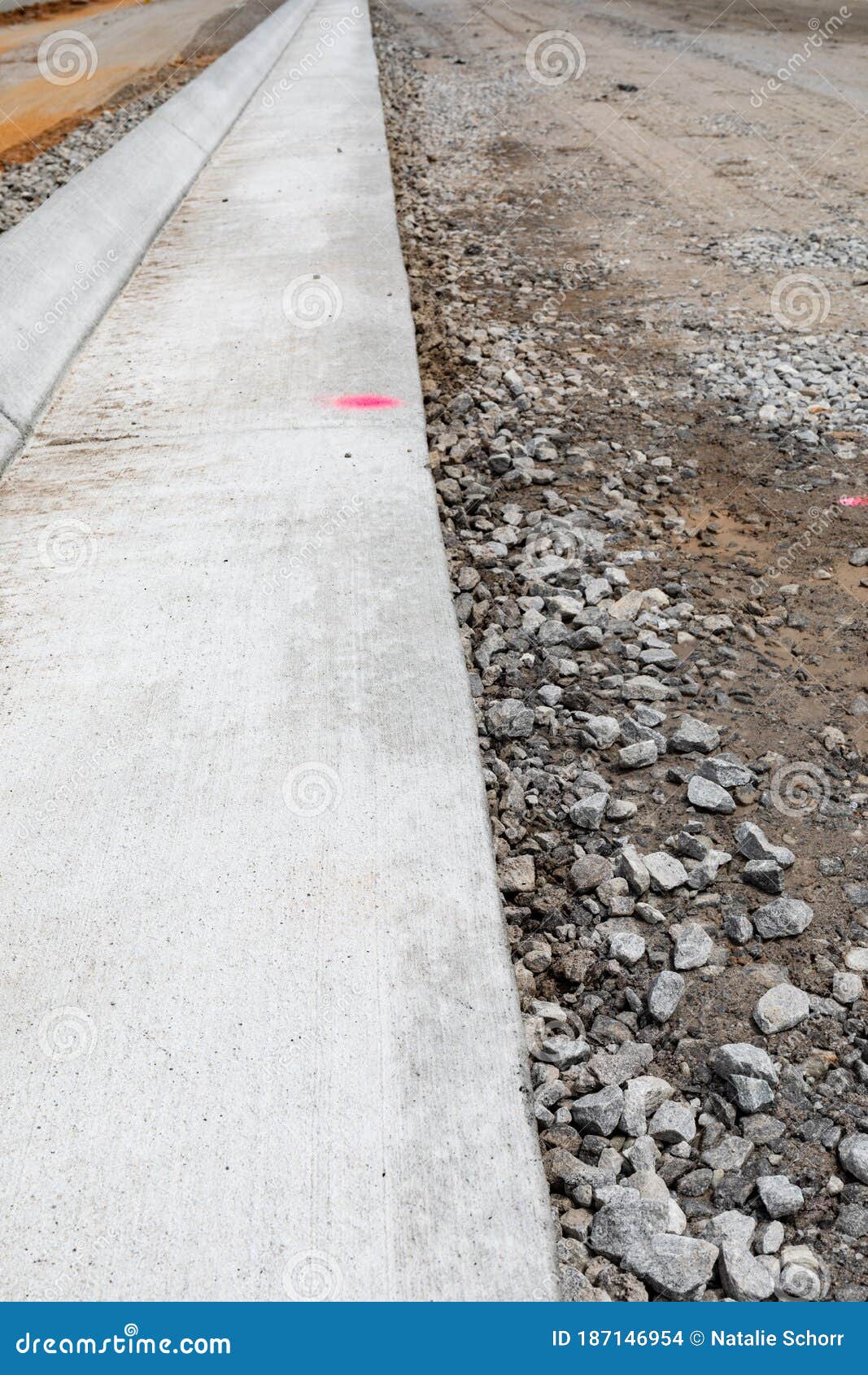 Long View Down Freshly Extruded Concrete Curb beside Road Bed Under ...