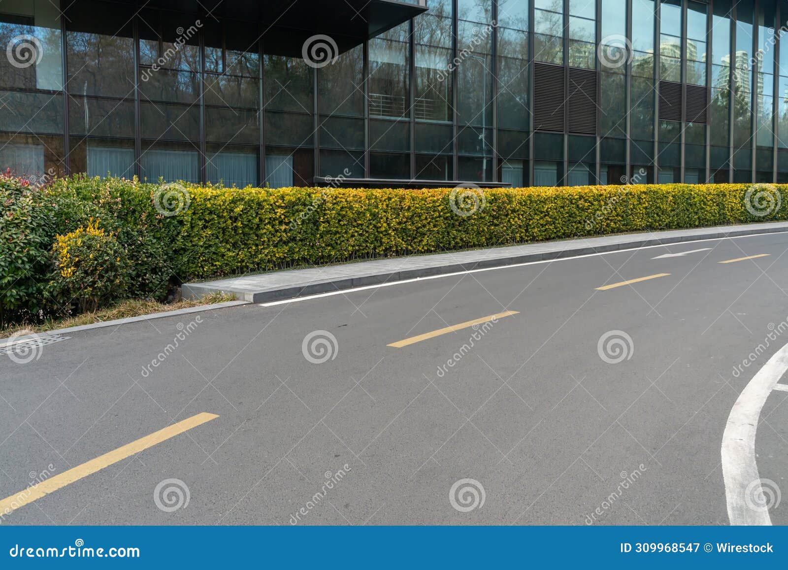 Long Winding Road in Front of a Building with Multiple Windows Stock ...