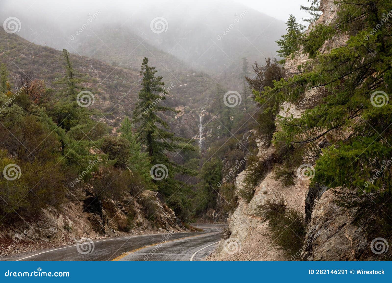 Long and Winding Road Snaking through the Fog-covered Mountainside ...