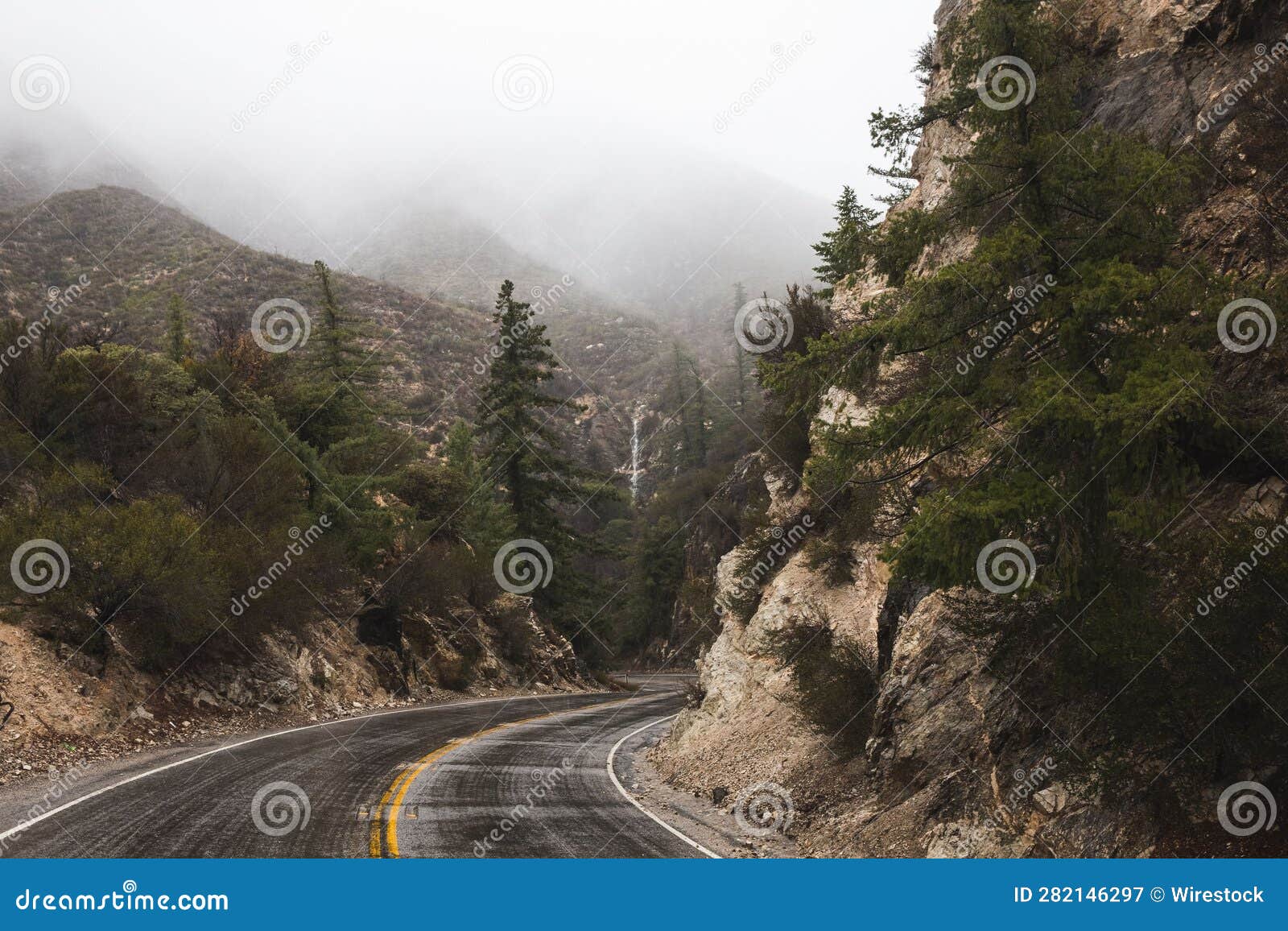 Long and Winding Road Snaking through the Fog-covered Mountainside ...