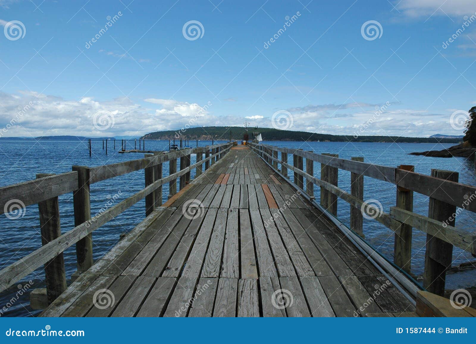 Long Wooden Pier stock photo. Image of railing, blue, cloud - 1587444