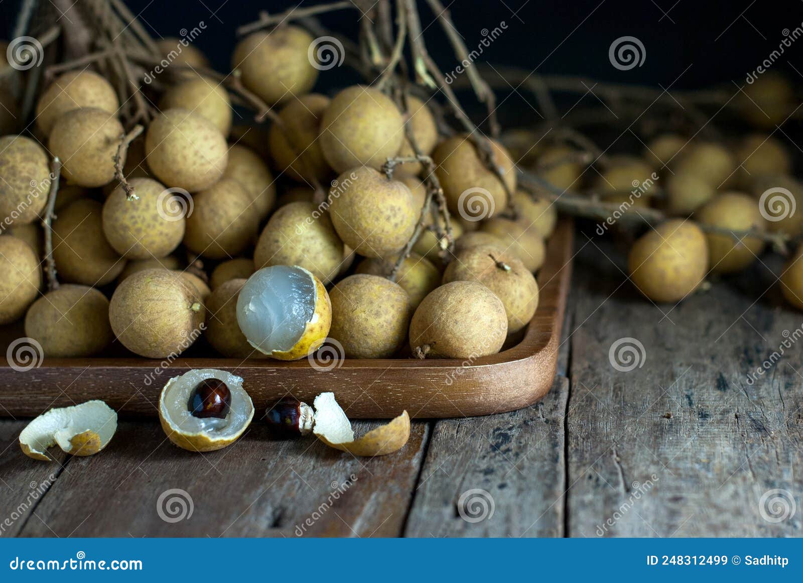 Longan Fruit is Placed in a Wooden Rectangle Tray and Rests on a Rustic ...