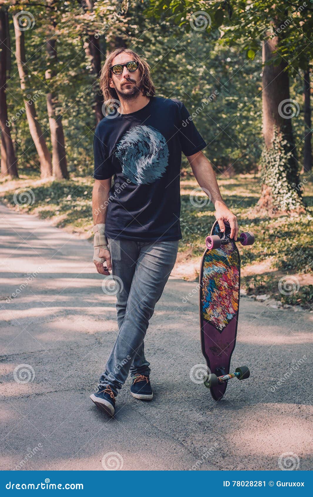 Longboard Skating - a Longboarder Posing beside His Longboard Stock ...