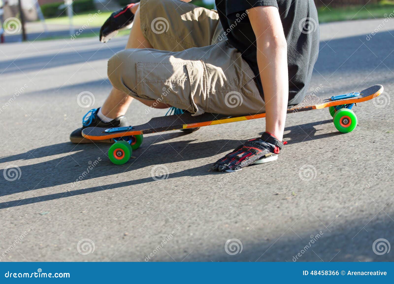 Longboarder Sitting stock photo. Image of skateboarding - 48458366