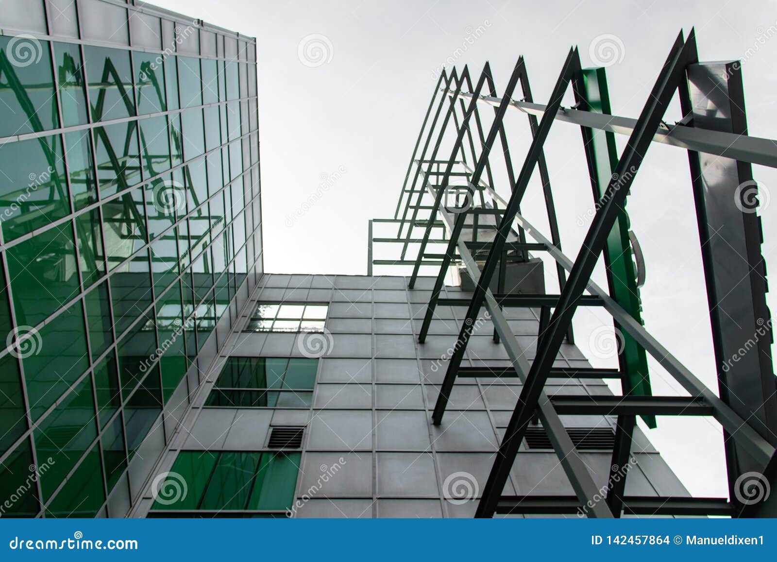 Modern Building with Green Windows and Triangles Stock Photo - Image of ...