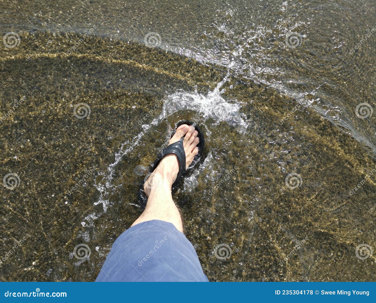 Look Down View of Foot Stepping Onto the Puddle Stock Photo - Image of ...