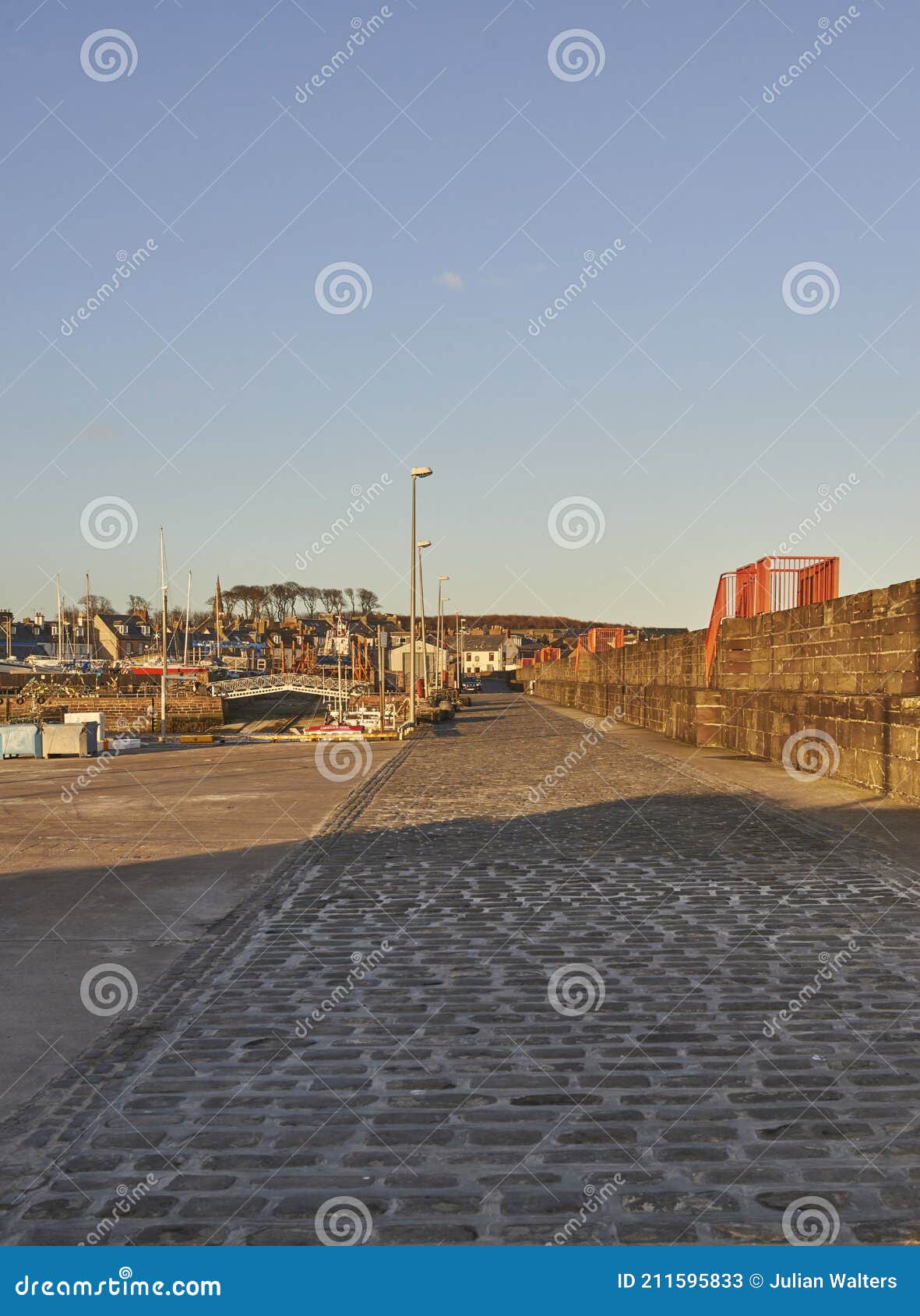 Looking Along the Harbour Wall of Arbroath Harbour in the Evening Light ...
