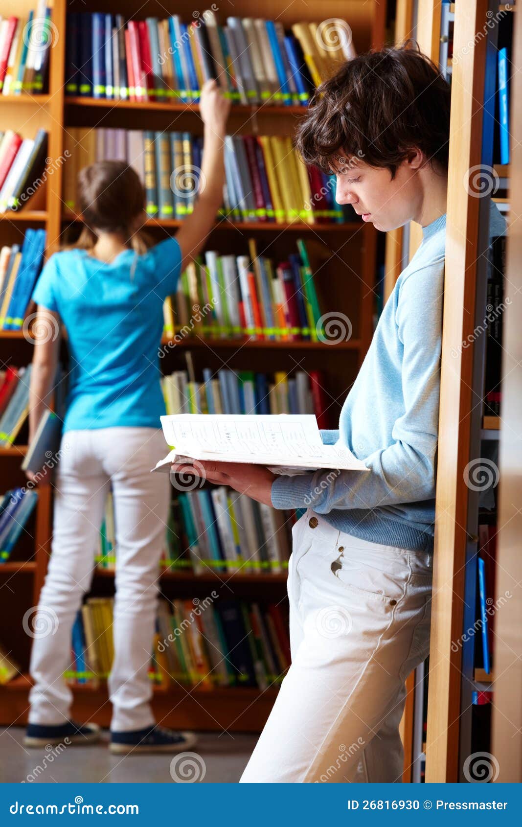 Looking through books stock photo. Image of knowledge - 26816930