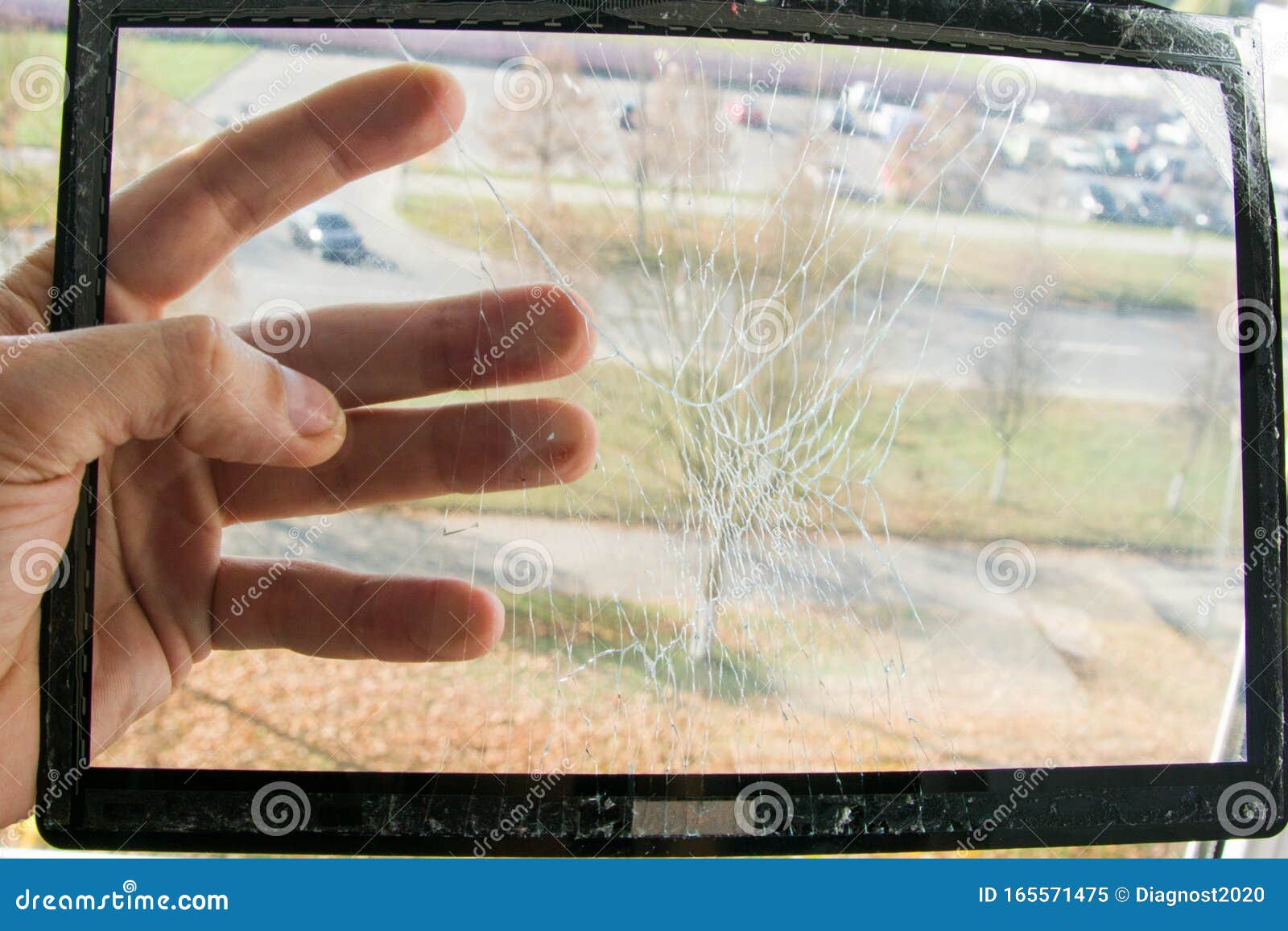 Looking through the Broken Touch Screen Damaged Tablet Computer. a ...