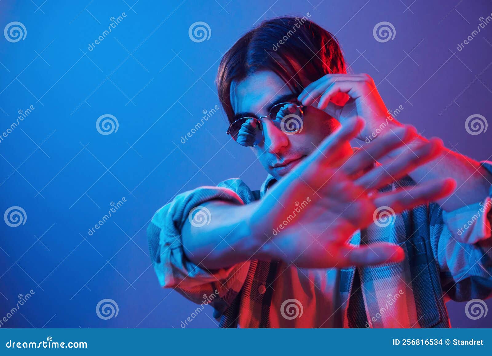 Looking into Camera. Man Standing in the Studio with Neon Light Stock ...