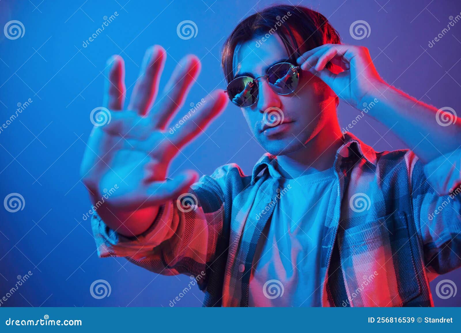Looking into Camera. Man Standing in the Studio with Neon Light Stock ...