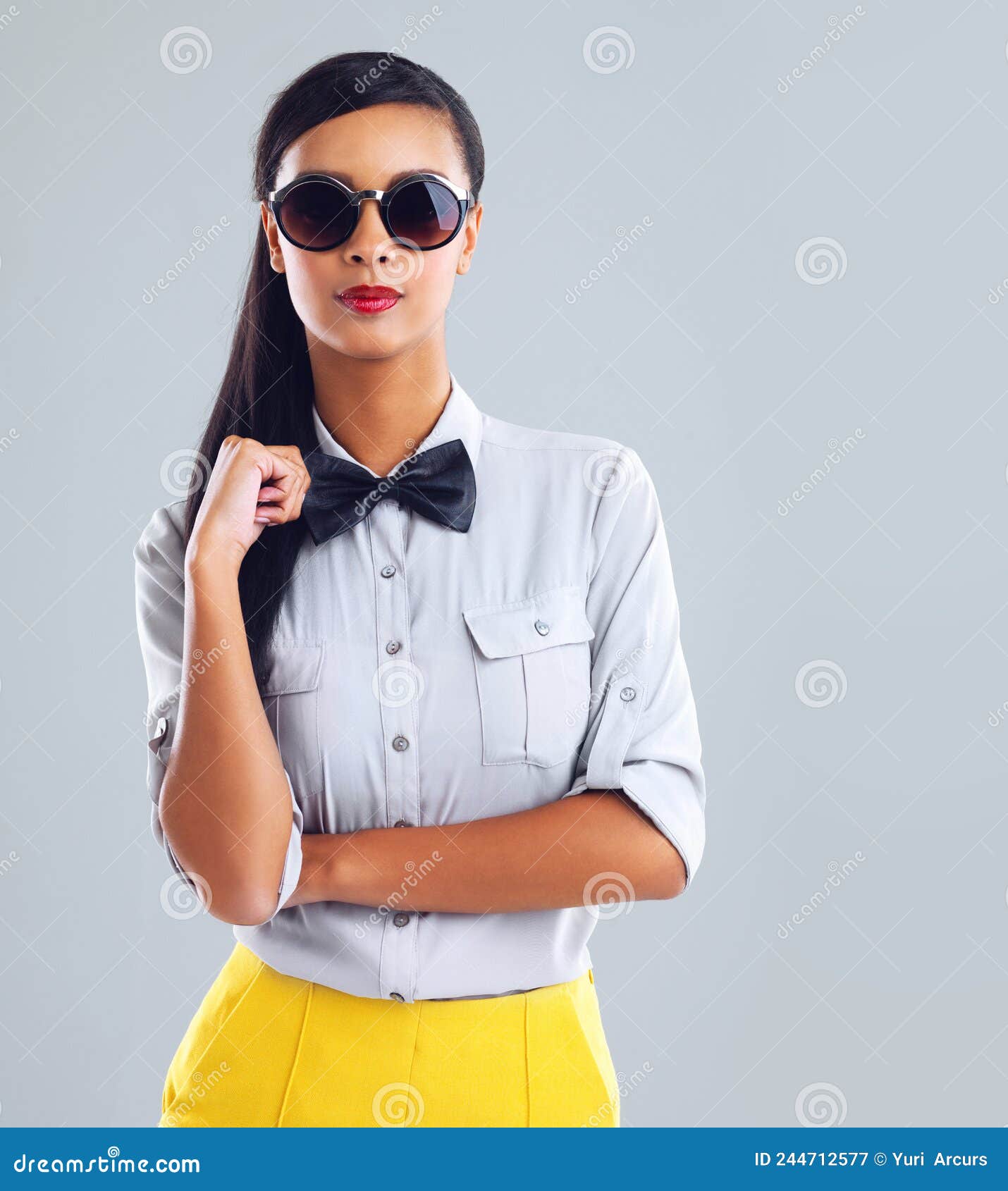 Looking Chic Cropped Portrait Of A Trendy Young Woman Wearing Shades