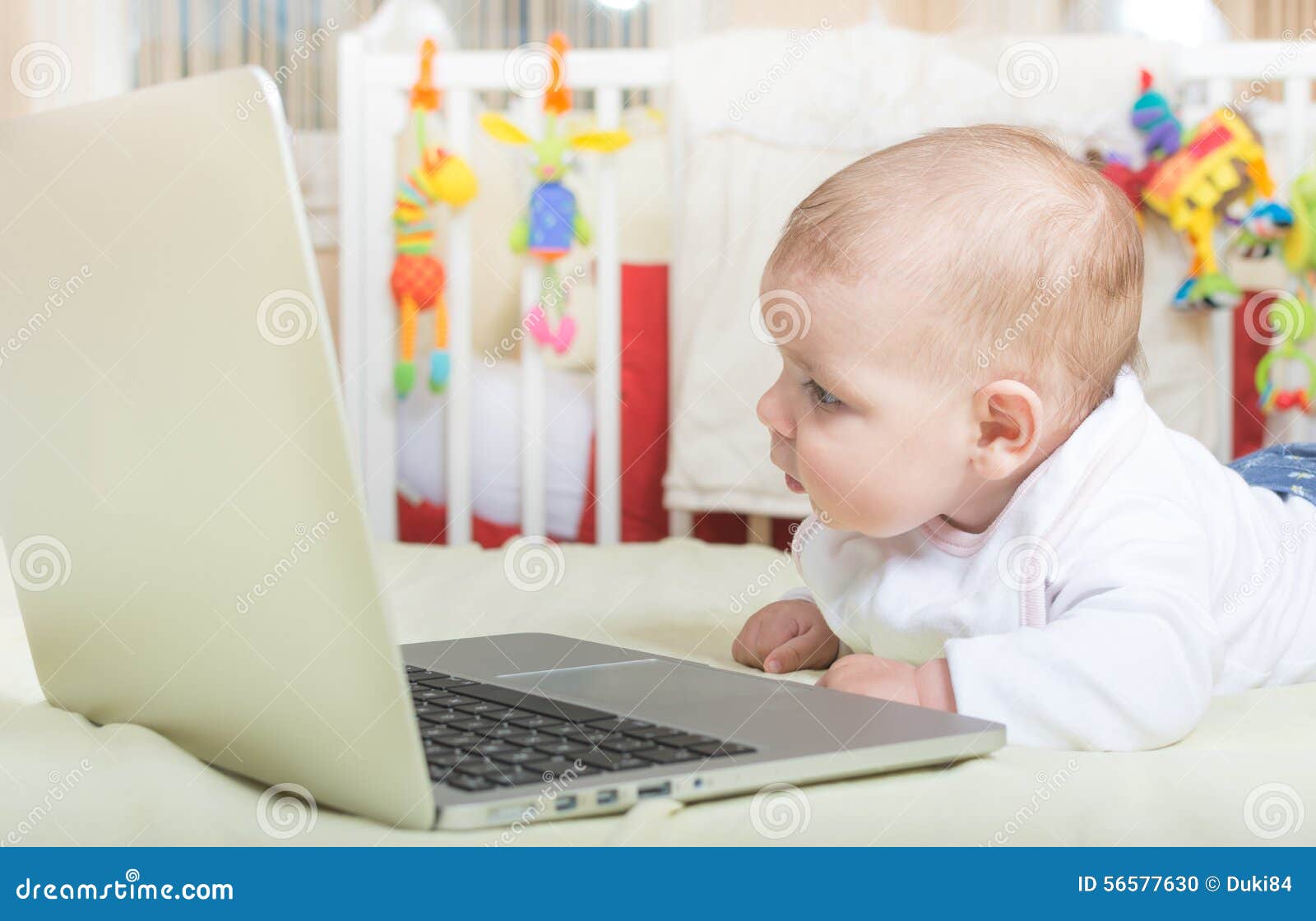 Looking at computer stock photo. Image of cute, hair - 56577630