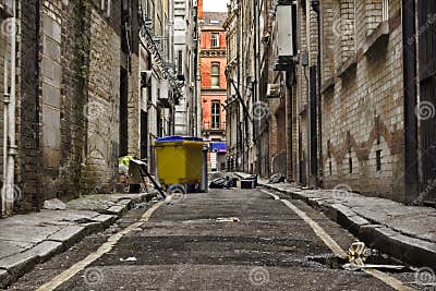 Looking Down a Long Dark Back Alley Stock Image - Image of light, alley ...