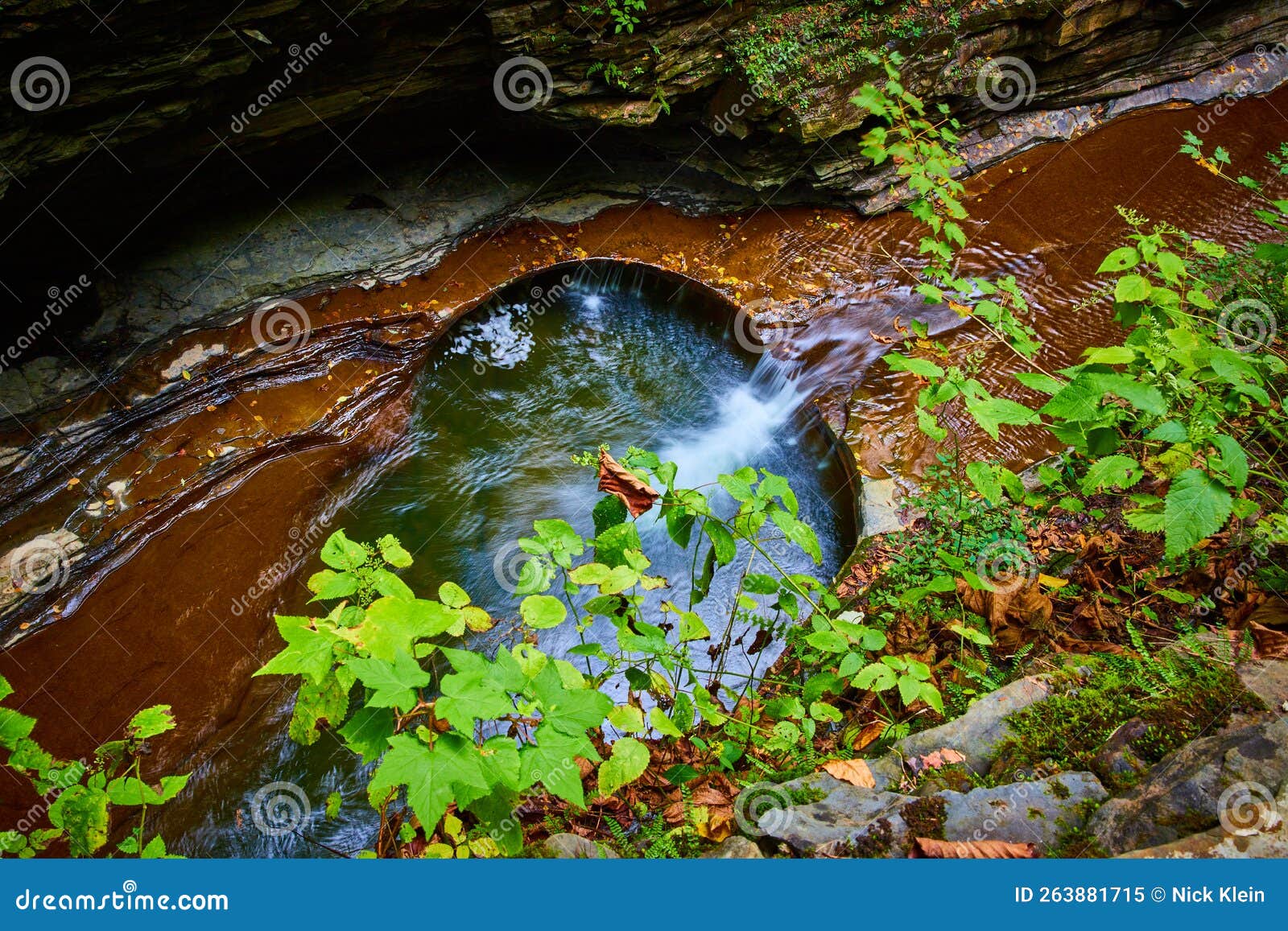 Looking Down at River and Small Waterfall Carving Circles into Rocks of ...