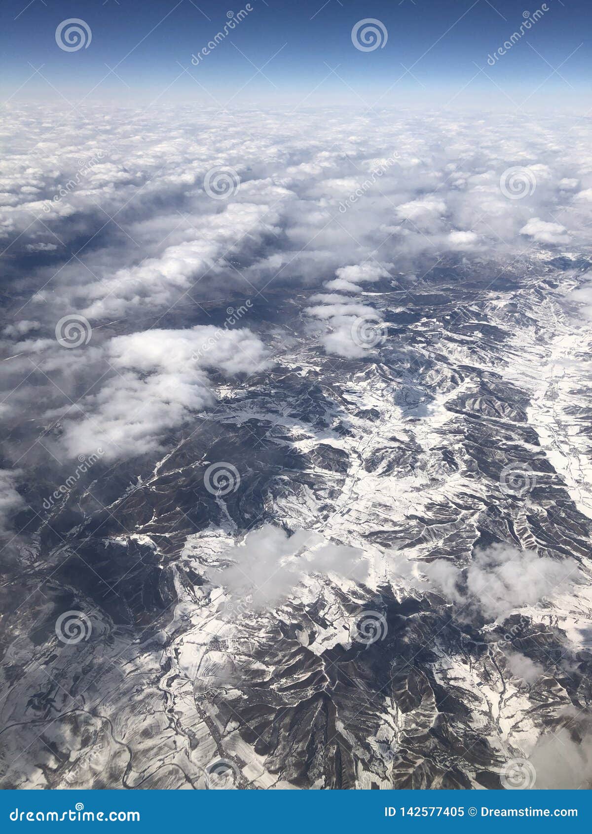 Looking Down from the Sky, the Earth Covered with Snow and White are ...