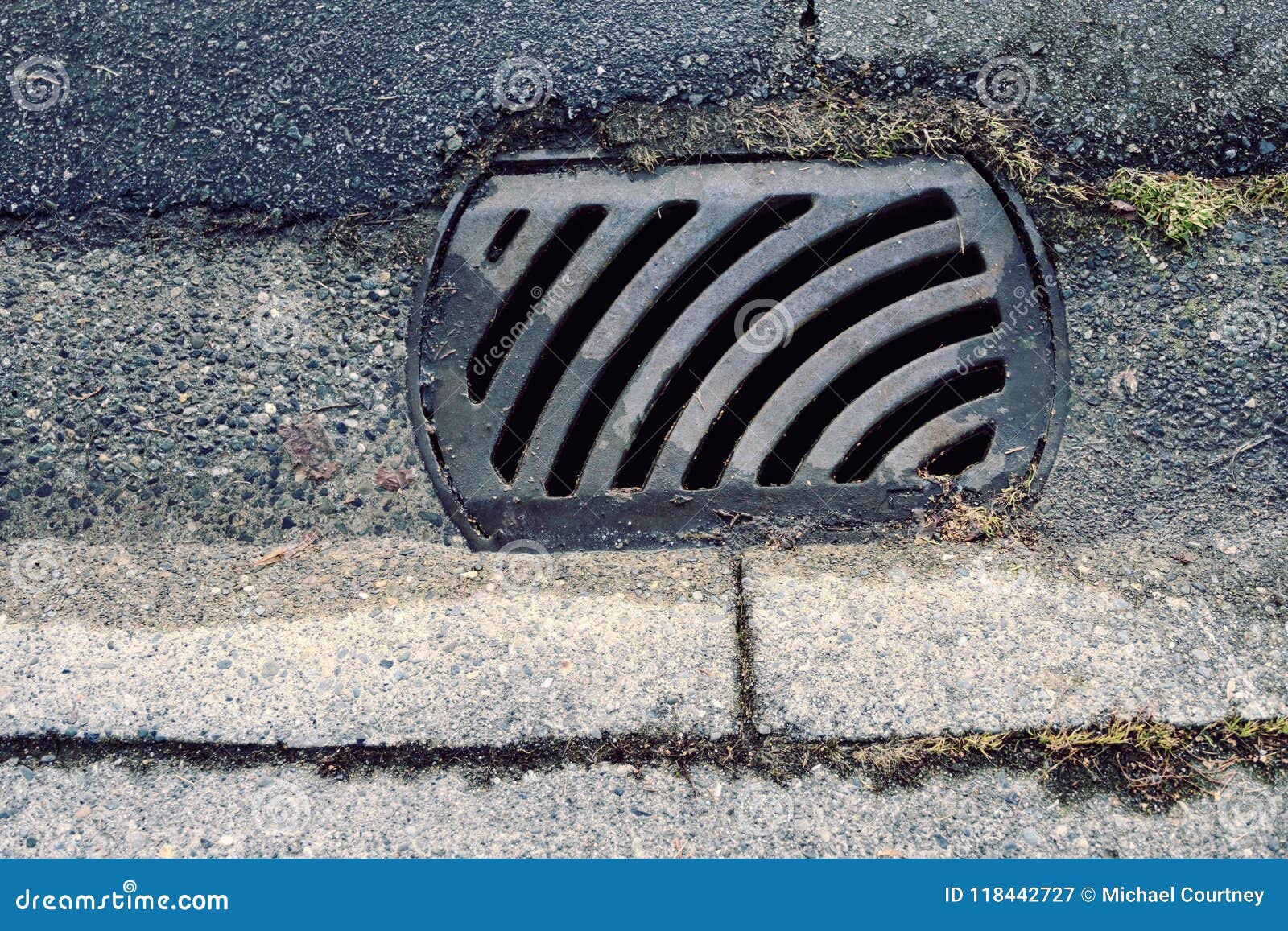 Looking Down at a Section of a Street Curb and Storm Drain Stock Image ...