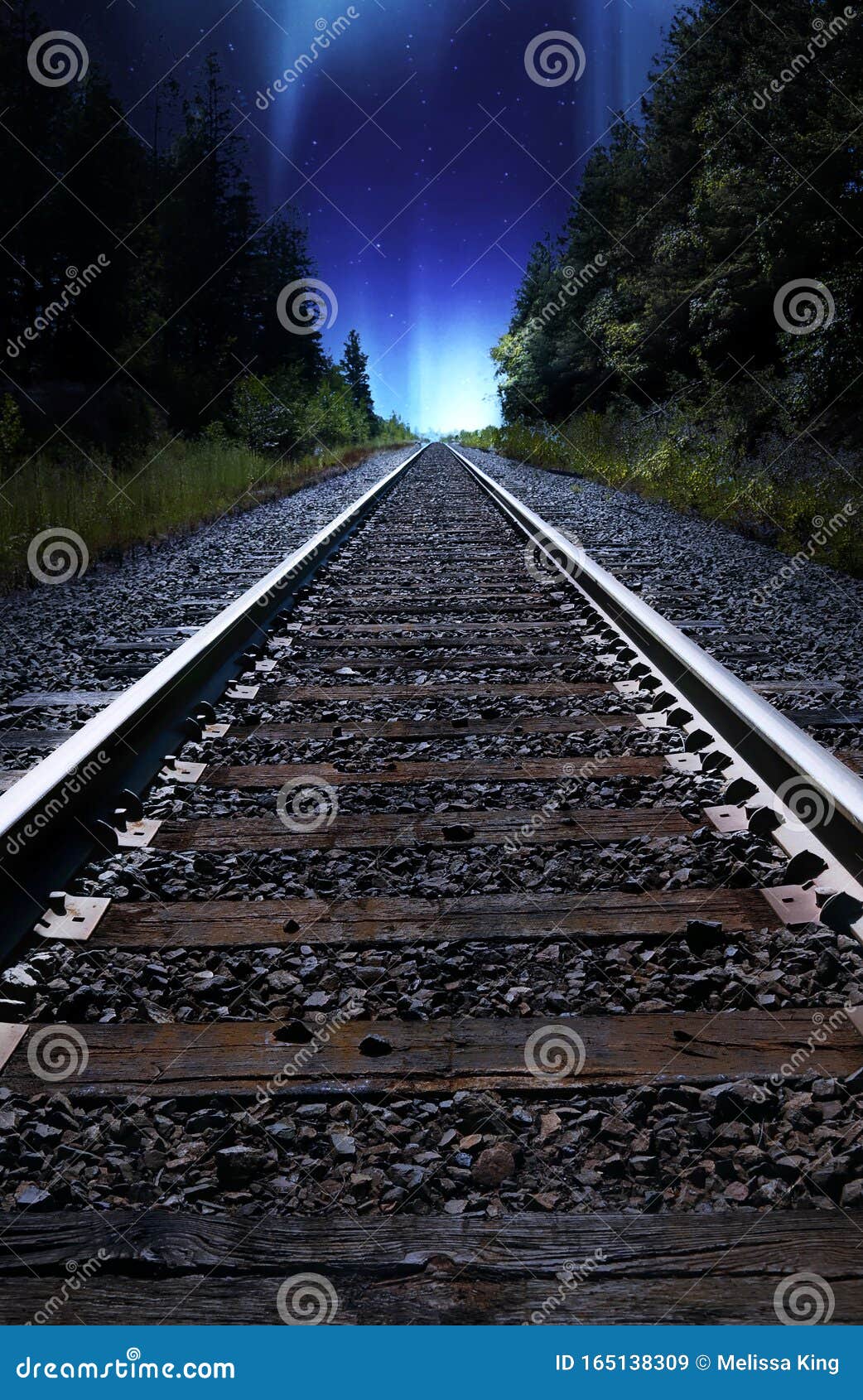 Looking Down Train Tracks at Night with Northern Lights in Sky Stock ...